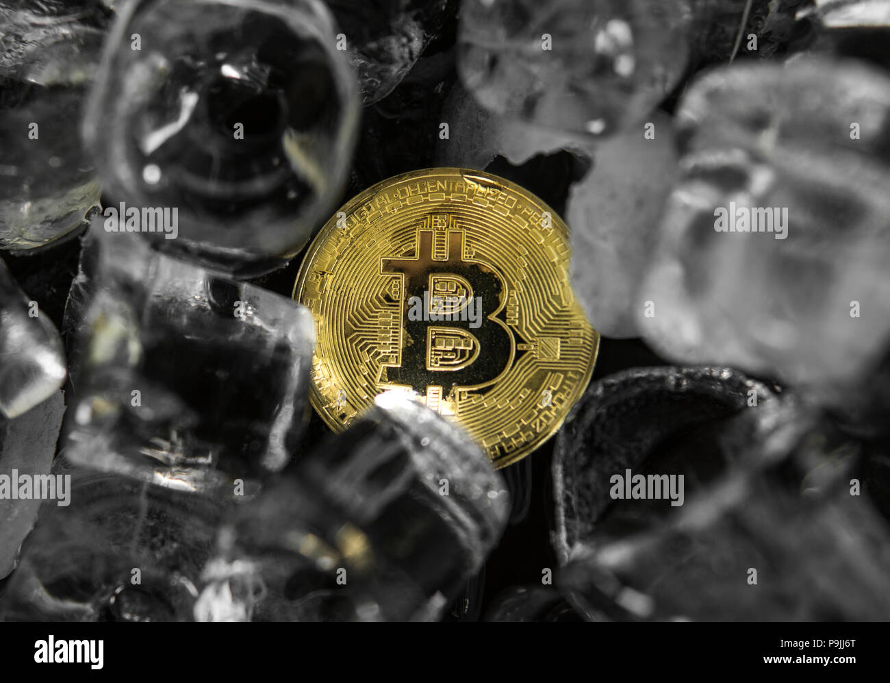 Gold bitcoin on ice background. The concept of the exchange in winter ...