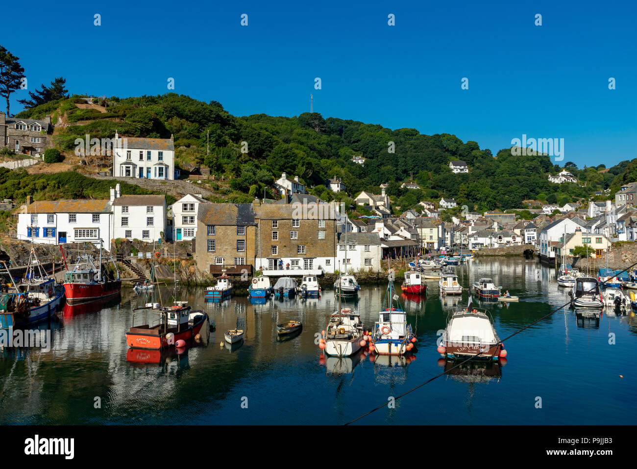 Polperro Cornwall England July 14, 2018 Early morning light on the harbour Stock Photo - Alamy