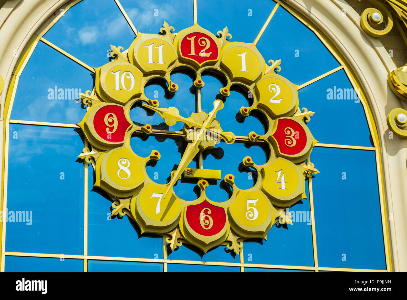 Clock on the ornamented building facade, yellow brick Stock Photo - Alamy