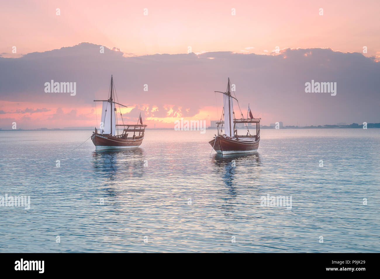 Traditional Arabic Dhow boats in Doha harbour Stock Photo - Alamy