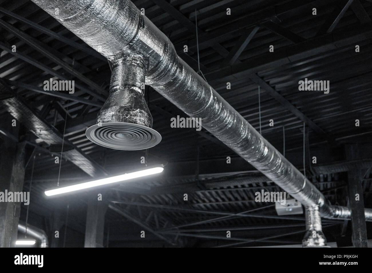Ventilation system on the ceiling of large buildings. Ventilation pipes ...