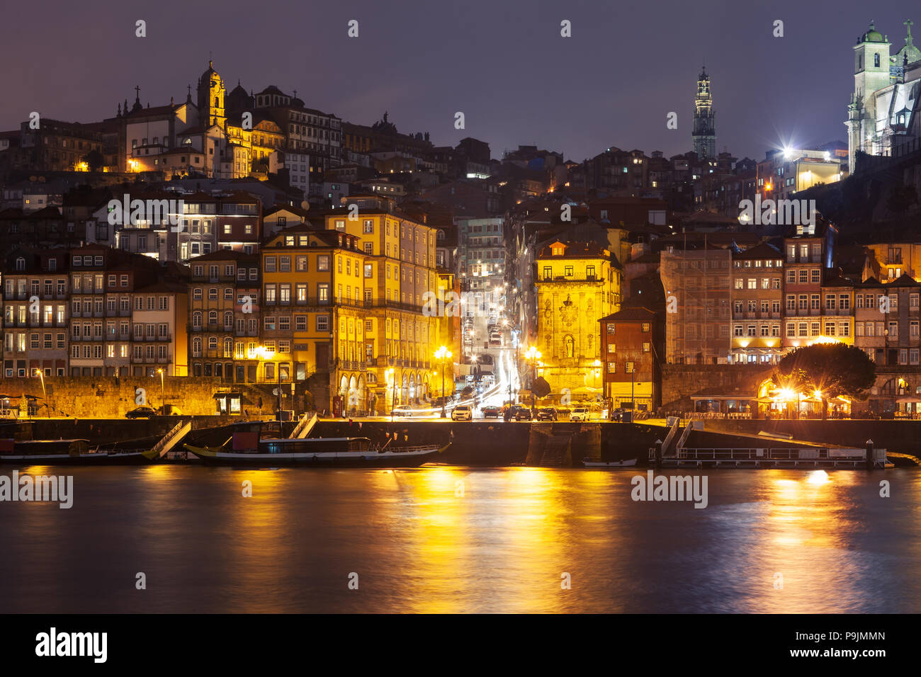 Night cityscape with reflection of the lights in water, Porto, Portugal ...