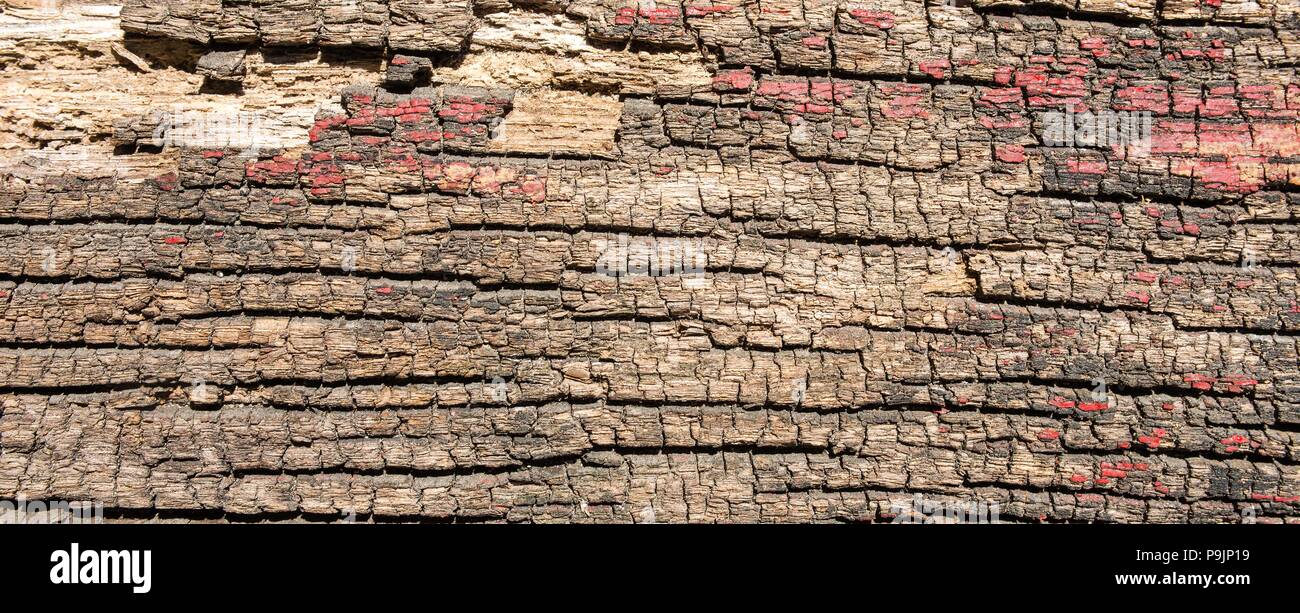 Weathered wood with red colour residues, detail, background image Stock ...