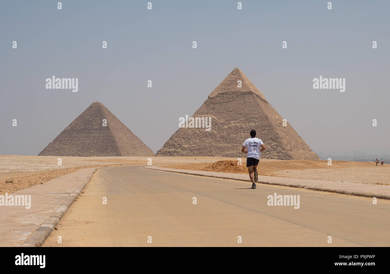 Man running in front of the Pyramids of Giza, Egypt Stock Photo - Alamy