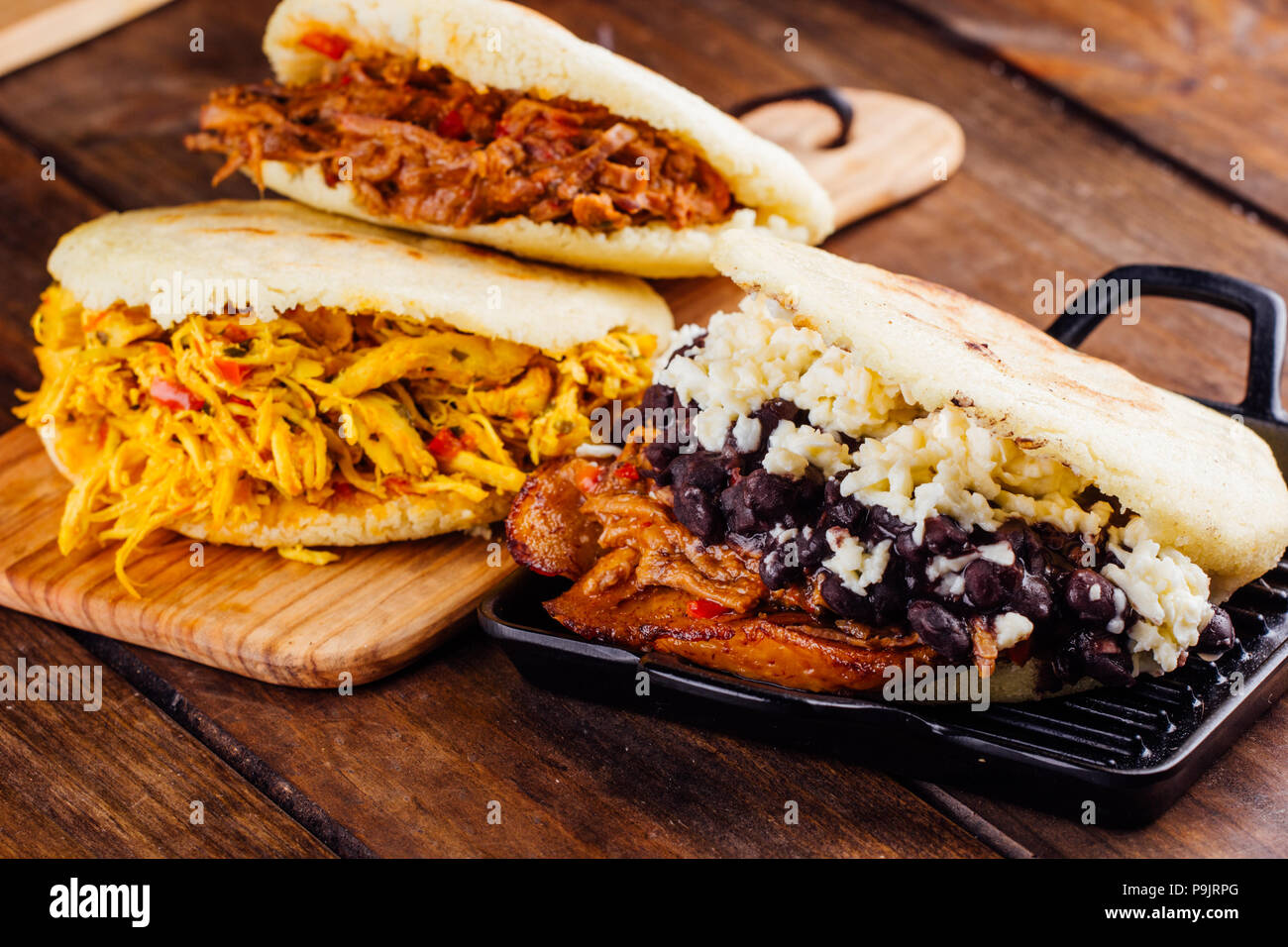 Venezuelan traditional Arepas freshly made, with 3 different fillings ...