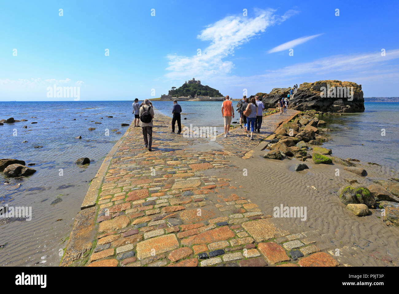 St Micheal's Mount and tourists on the causeway waiting for low tide in ...