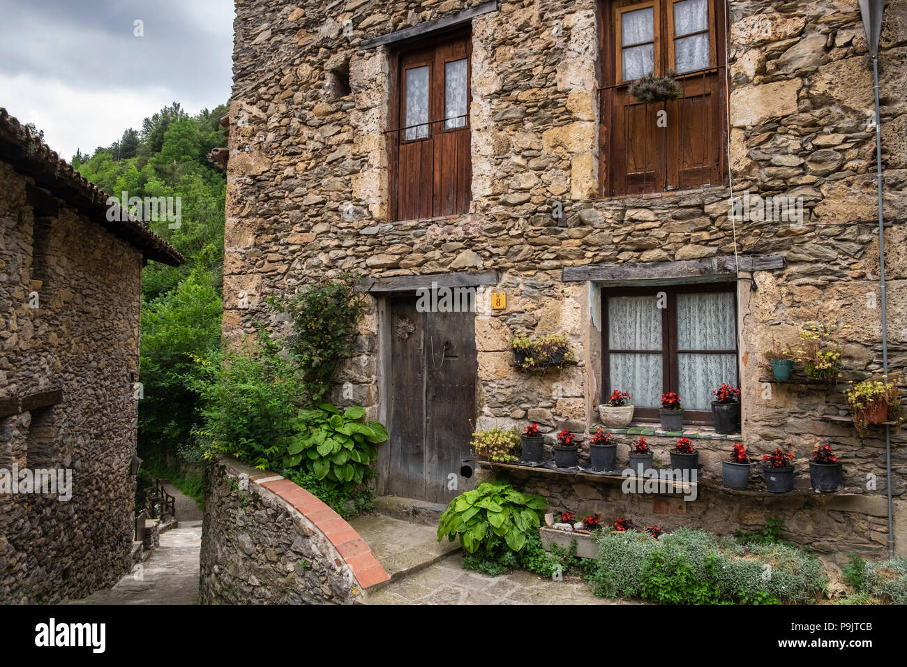 Typical traditional architecture in a golden ochre granite stone in the ...