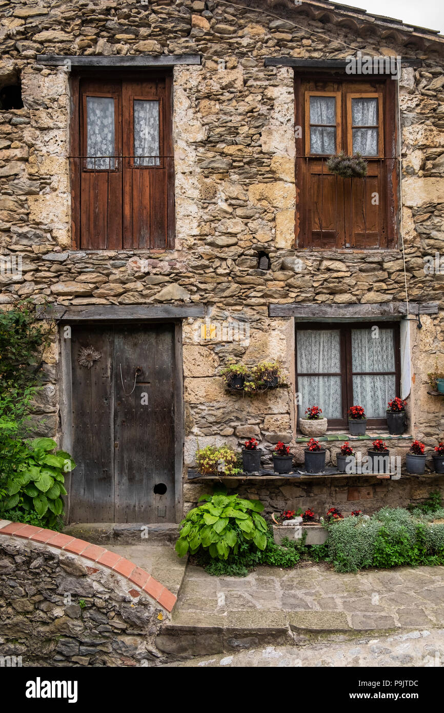 Typical traditional architecture in a golden ochre granite stone in the ...