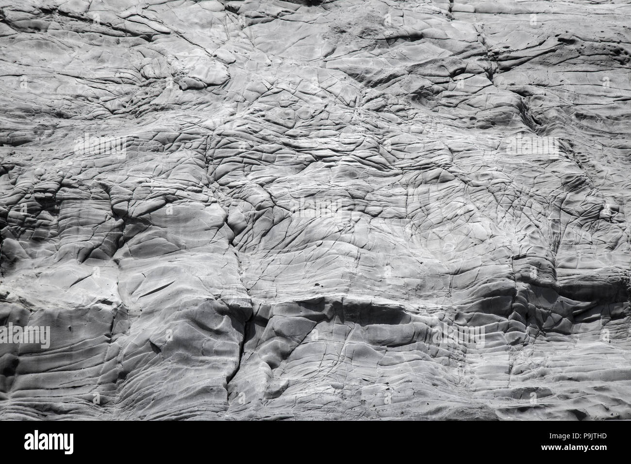 old lava background - volcanic origin rock with many smooth folds ...