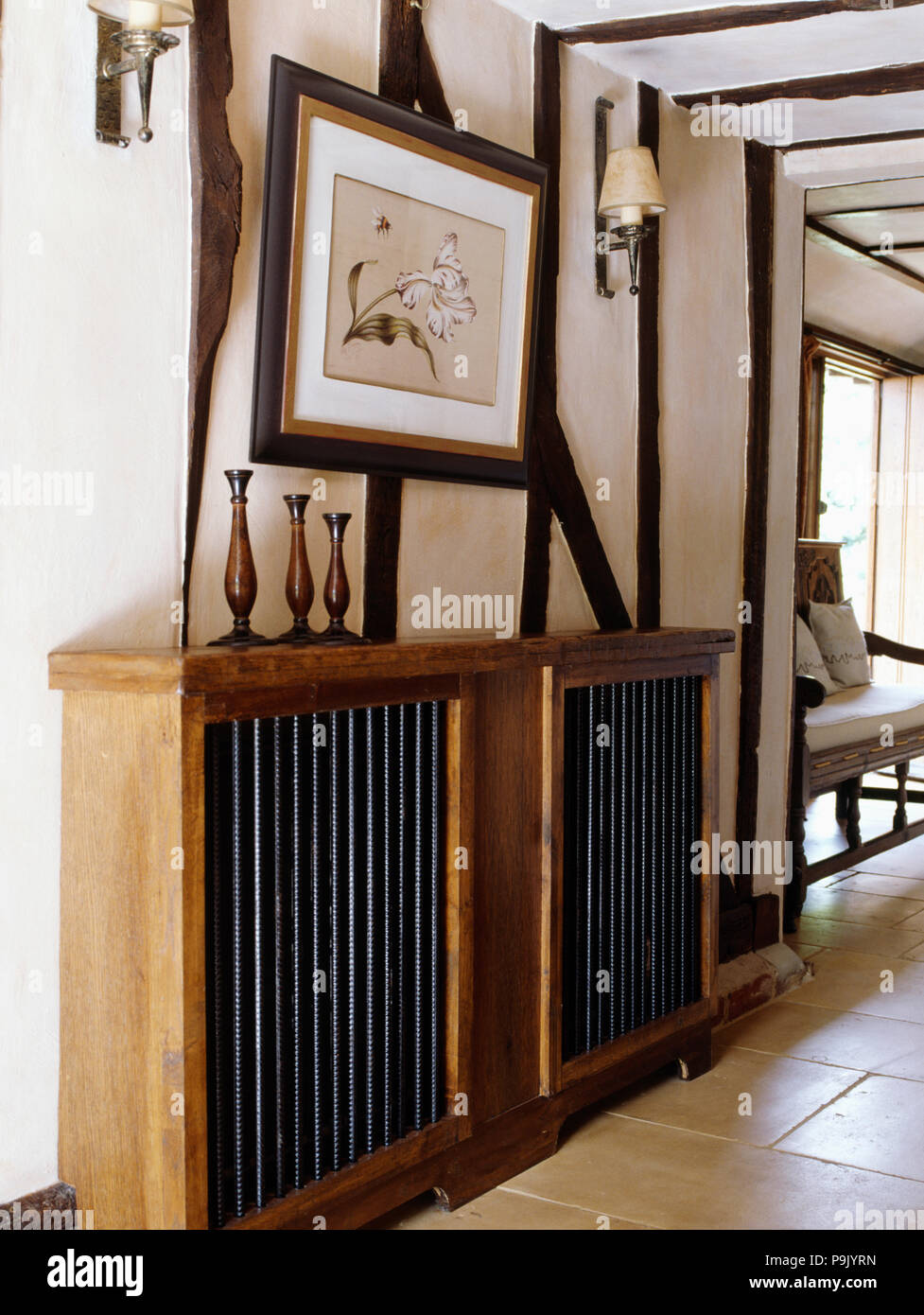 Picture above covered radiator in beamed country hall Stock Photo - Alamy