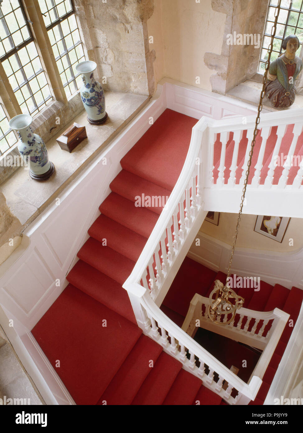 Aerial view of red carpet on white Georgian staircase with stone ...