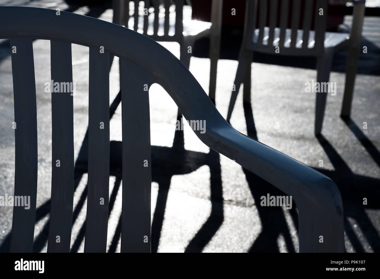 Black chairs and shadows hi-res stock photography and images - Alamy