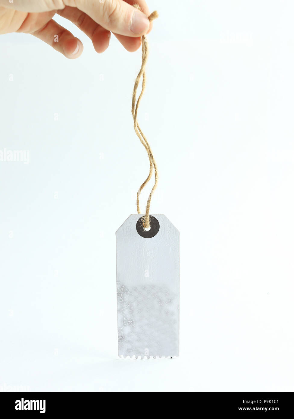 blank cardboard tag on a white background Stock Photo - Alamy