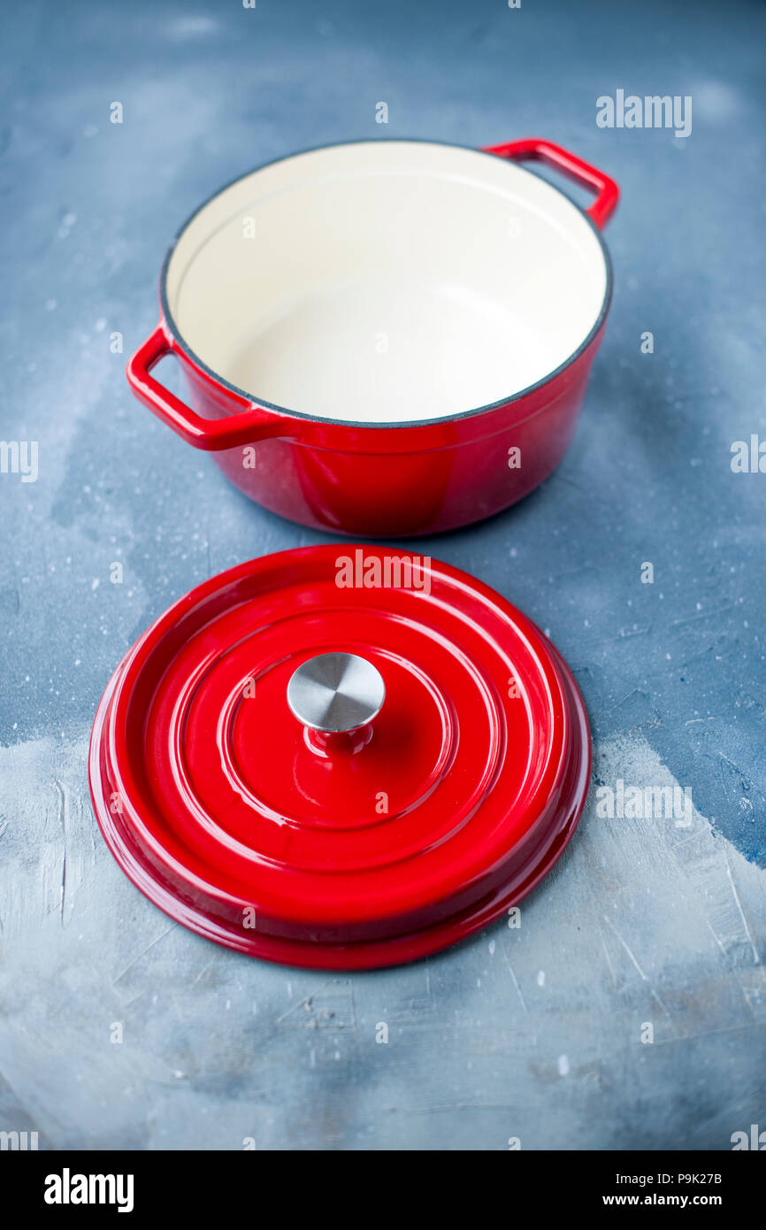 A new pan made of thick red iron. On a gray stone background. Free ...