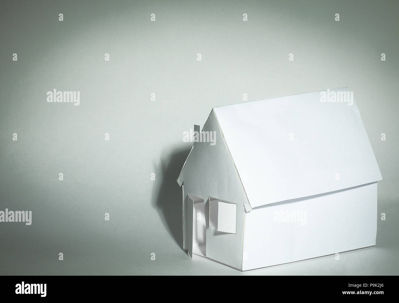 paper house paper background.the concept of a mortgage Stock Photo - Alamy