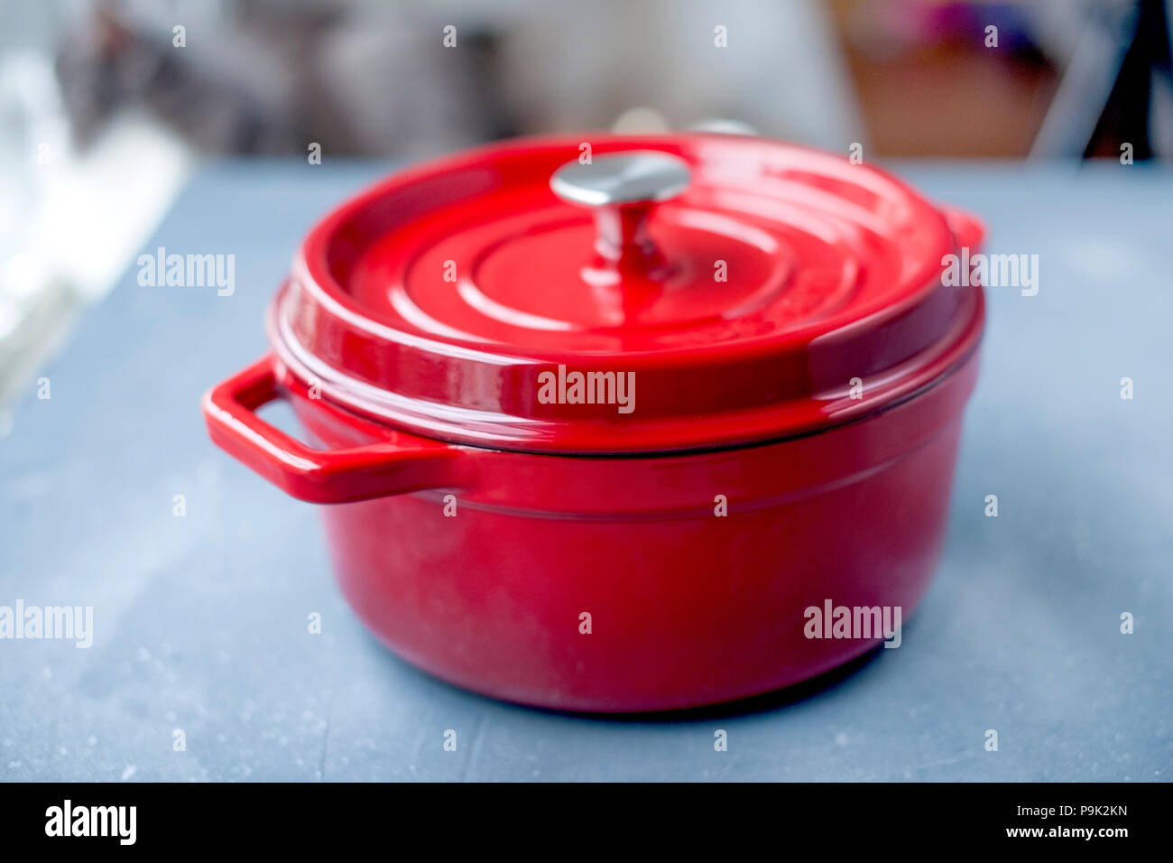 A new pan made of thick red iron. On a gray stone background. Free ...