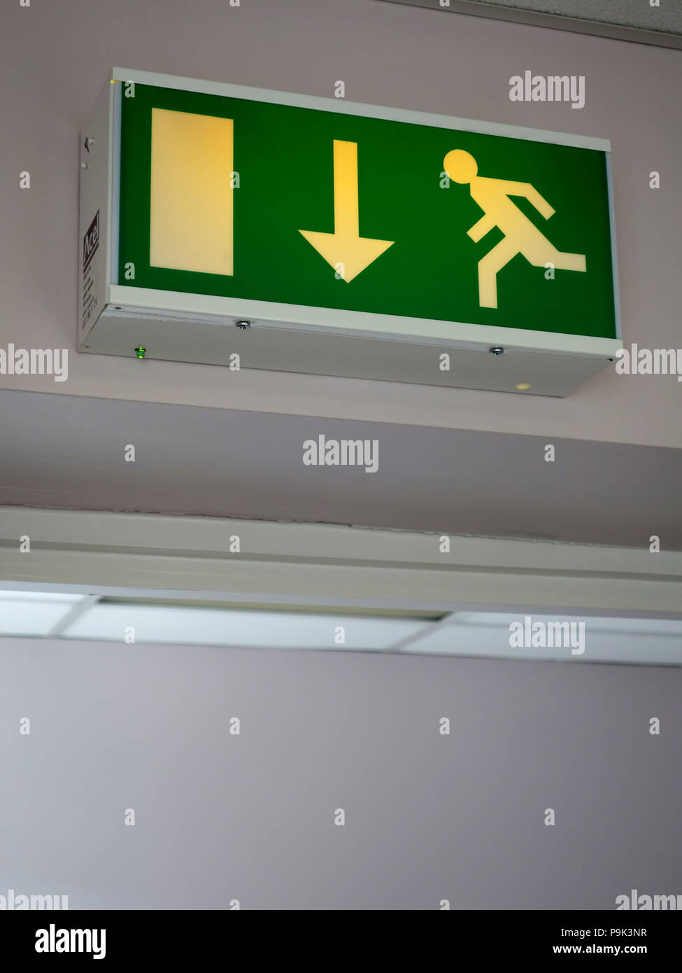 Running man icon Emergency exit sign above fire escape from first floor ...
