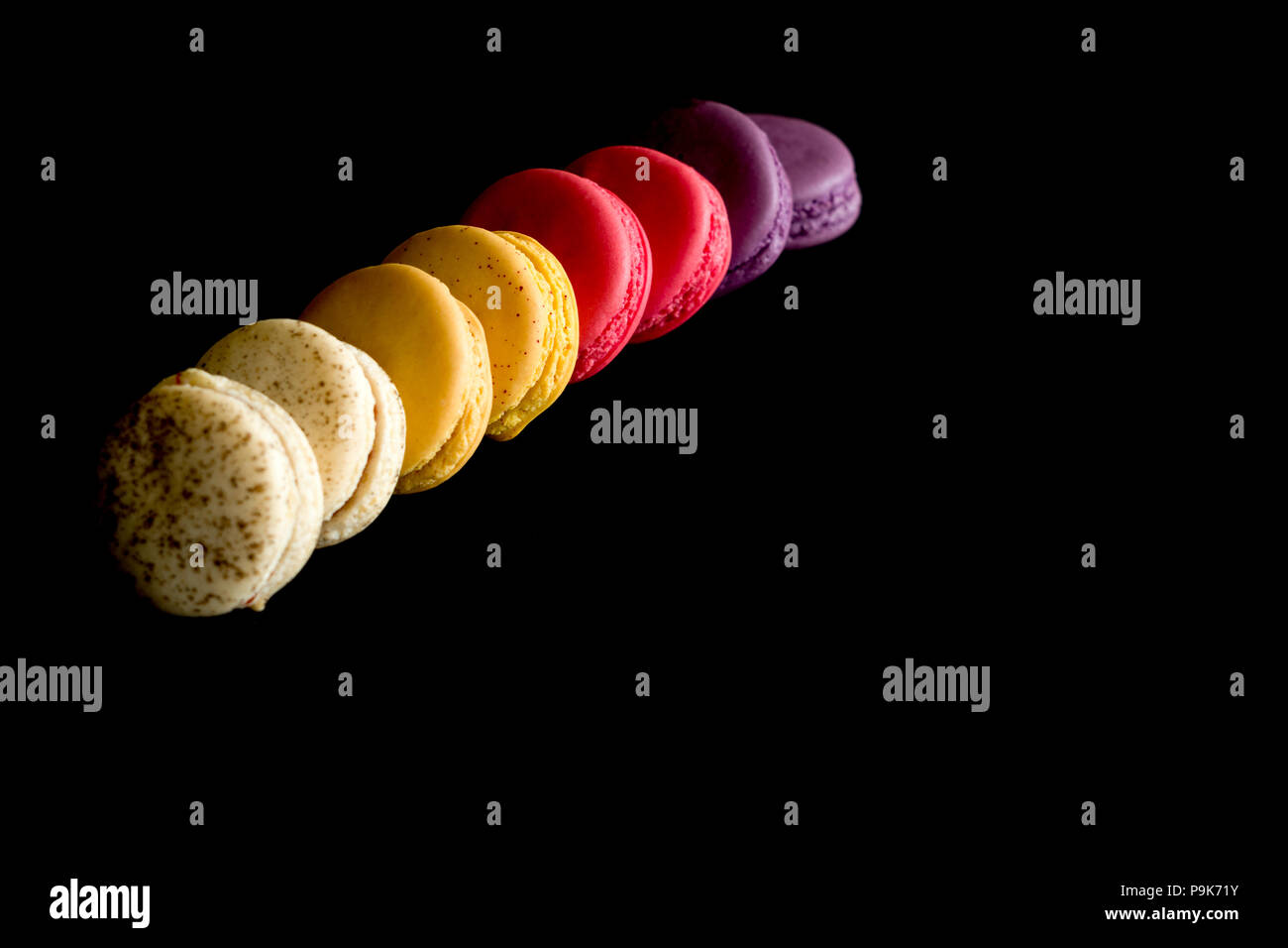 Some macaroons on black Stock Photo - Alamy