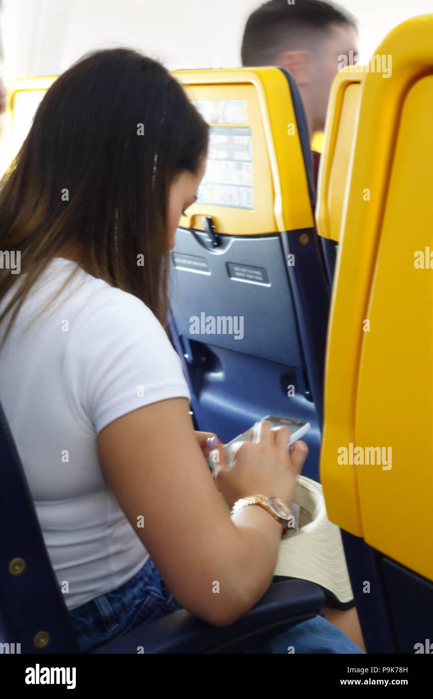 Sending text on flight cabin hi-res stock photography and images - Alamy