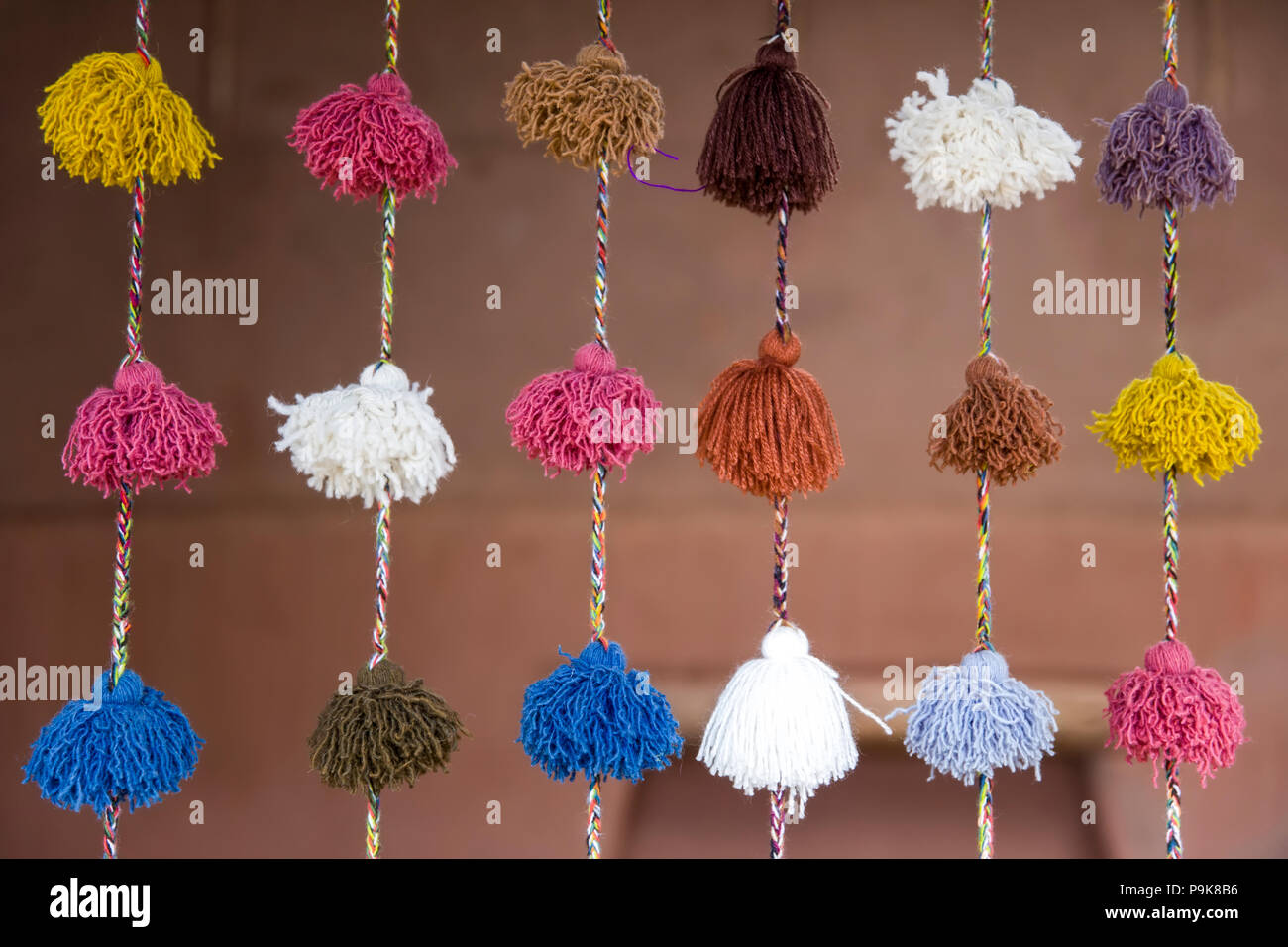 View at colorful wool samples hanging on the market Stock Photo - Alamy