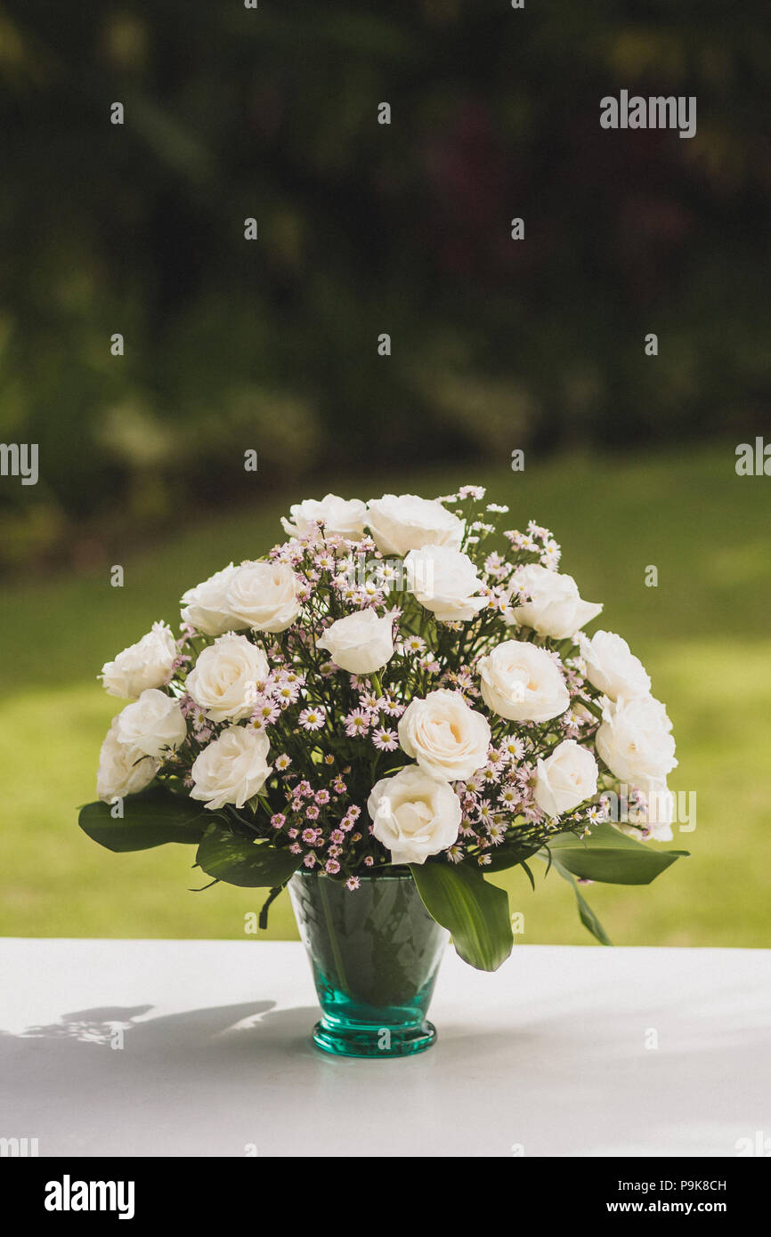 Wedding flower composition. Bouquet with big white roses and chamomiles ...