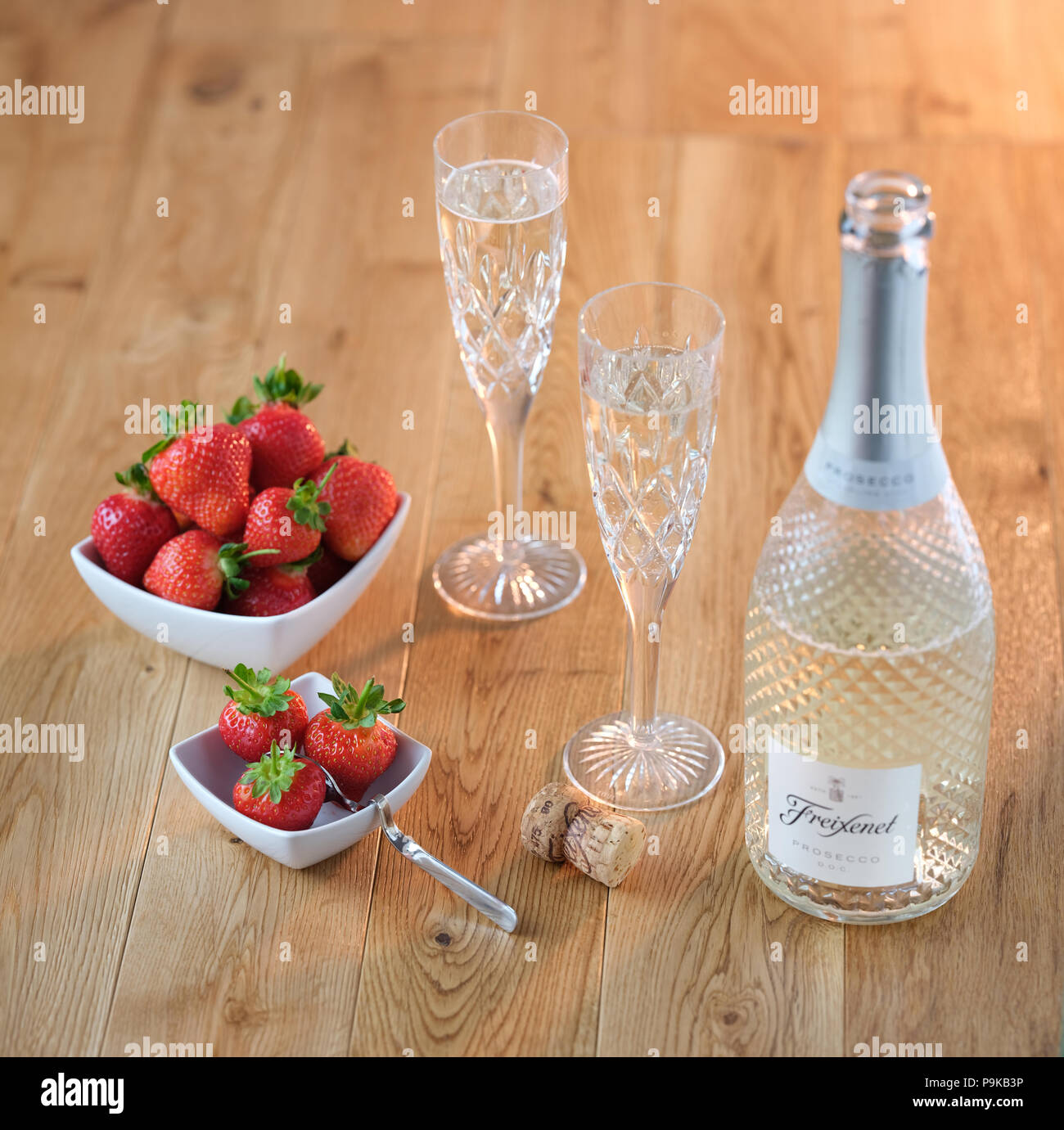 Prosecco and Strawberries cut crystal glasses flower wallpaper wooden ...