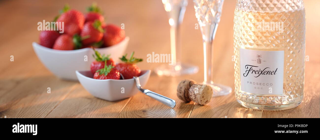 Prosecco and Strawberries cut crystal glasses flower wallpaper wooden ...