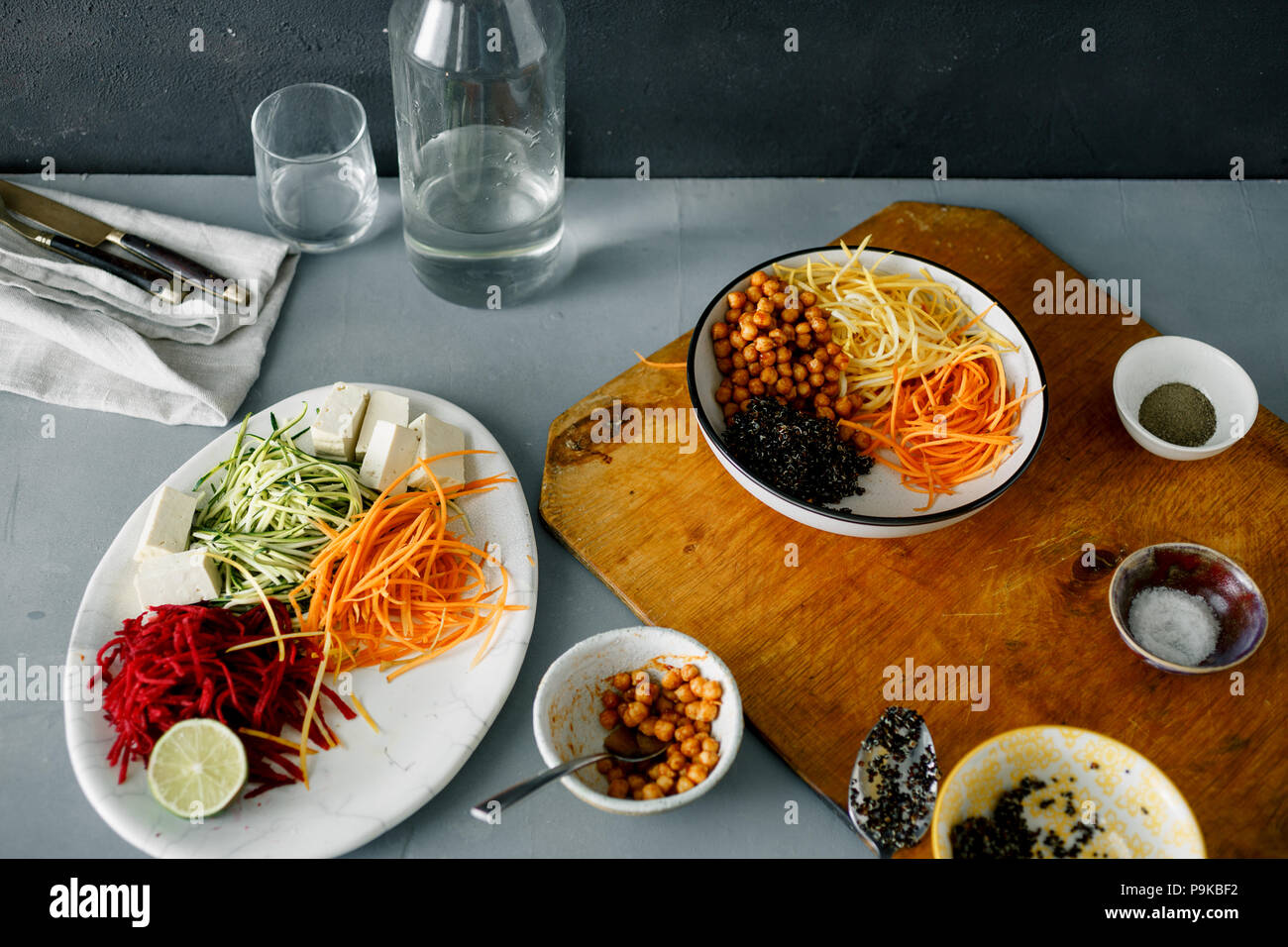 Cooking bowl buddha of spiralized vegetables on gray concrete table ...