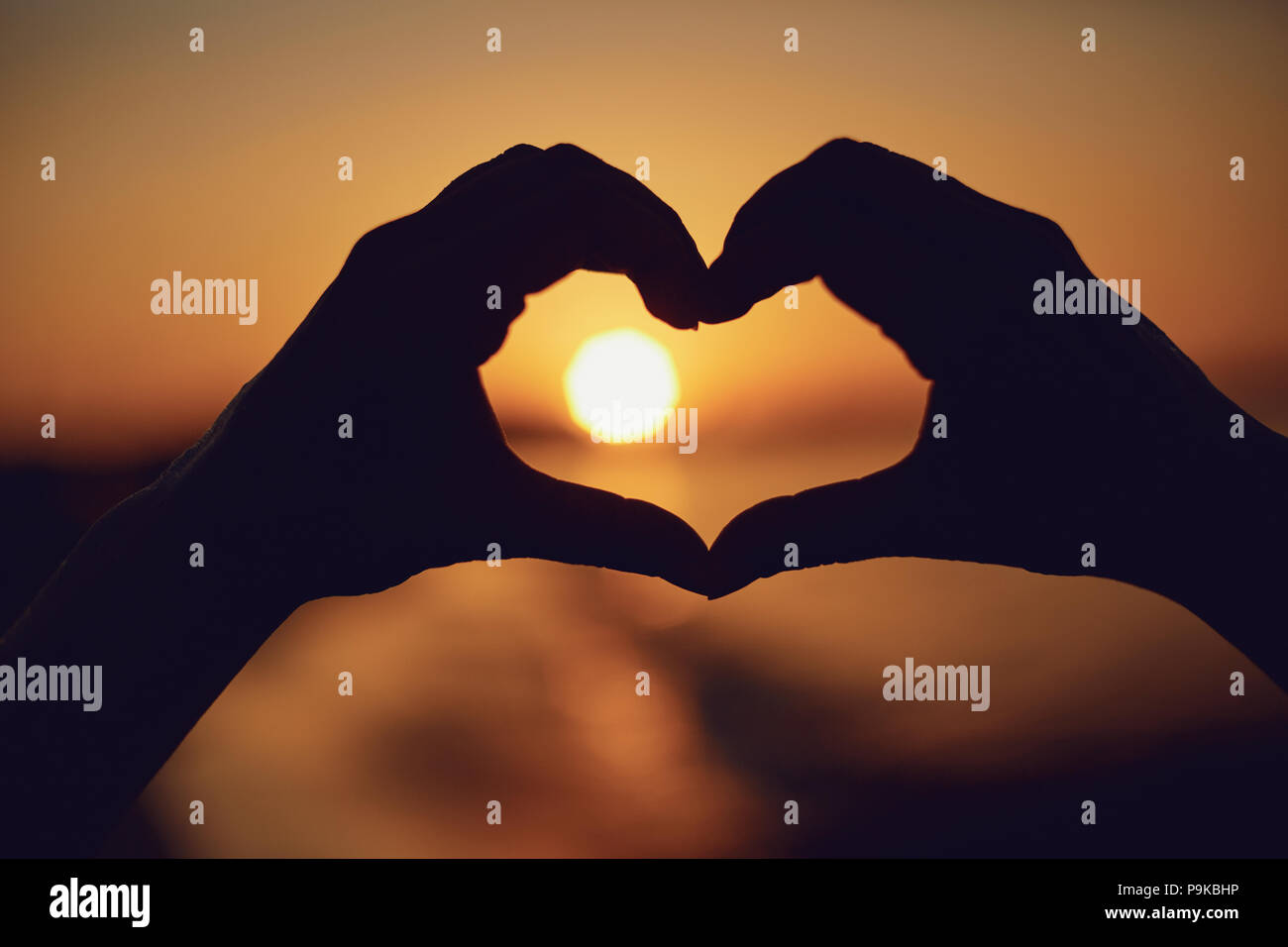 Heart hands gesture sunrise silhouette hi-res stock photography and ...
