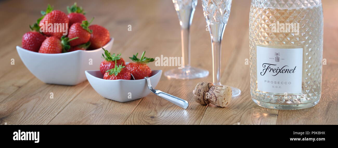 Prosecco and Strawberries cut crystal glasses flower wallpaper wooden ...