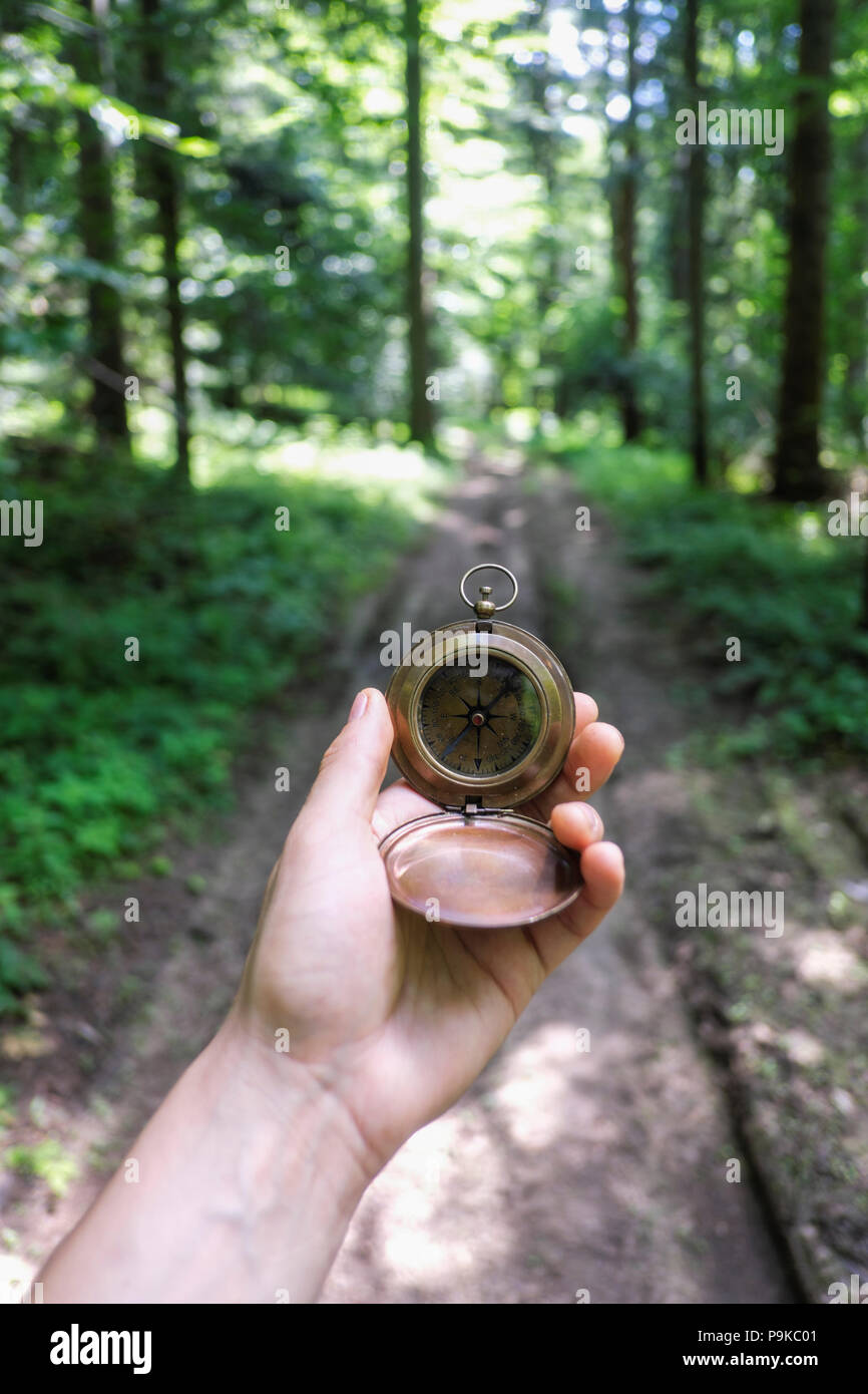 Compass holding in hand hi-res stock photography and images - Alamy