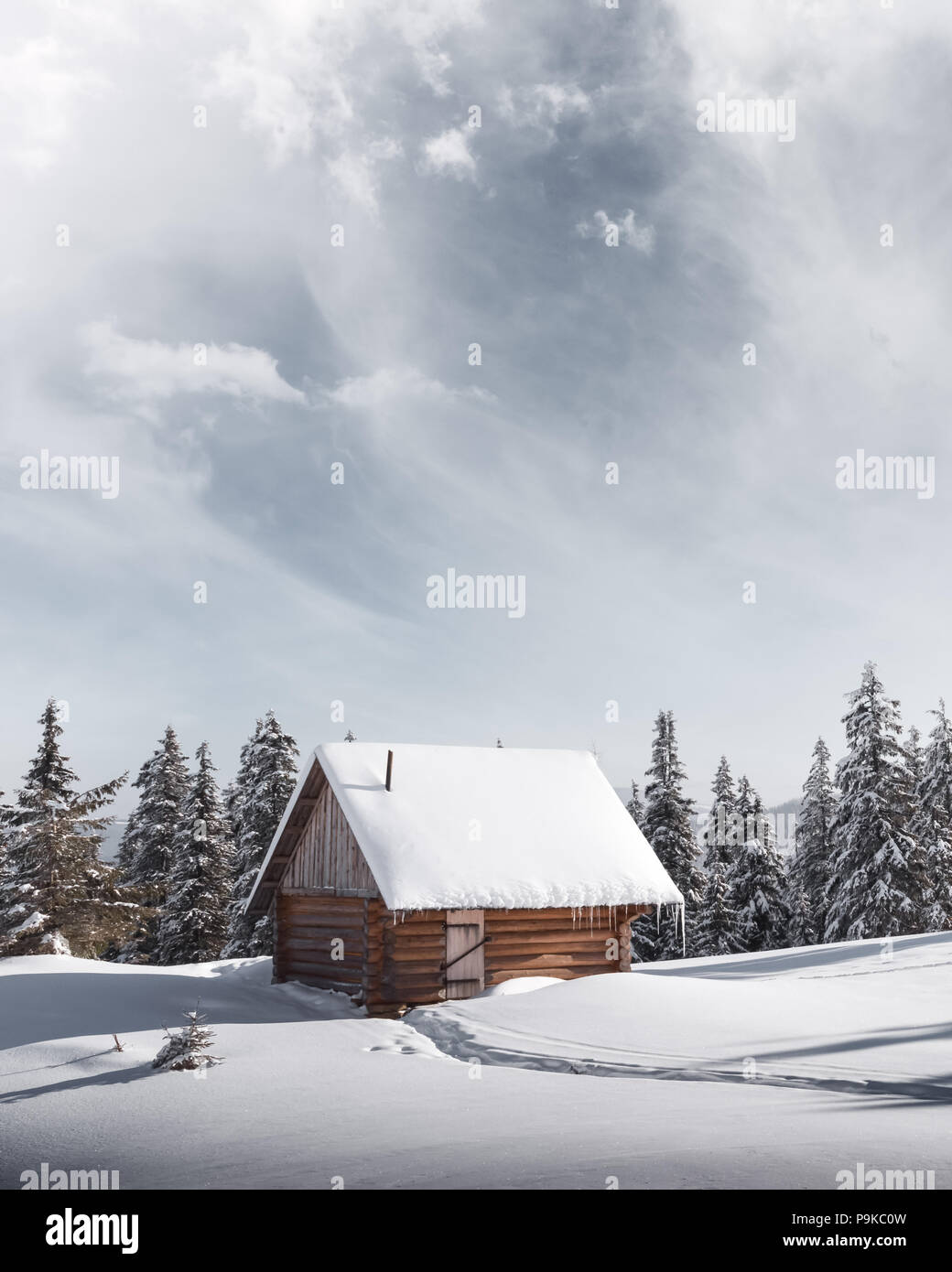 Fantastic landscape with snowy house Stock Photo - Alamy