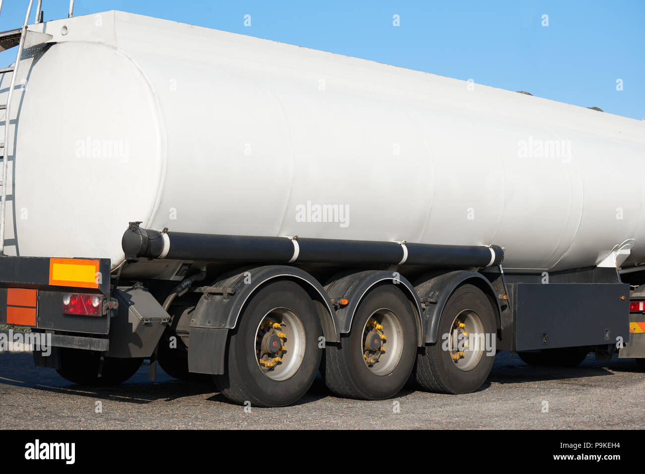 white blank tank truck, rear view, one object on road Stock Photo - Alamy