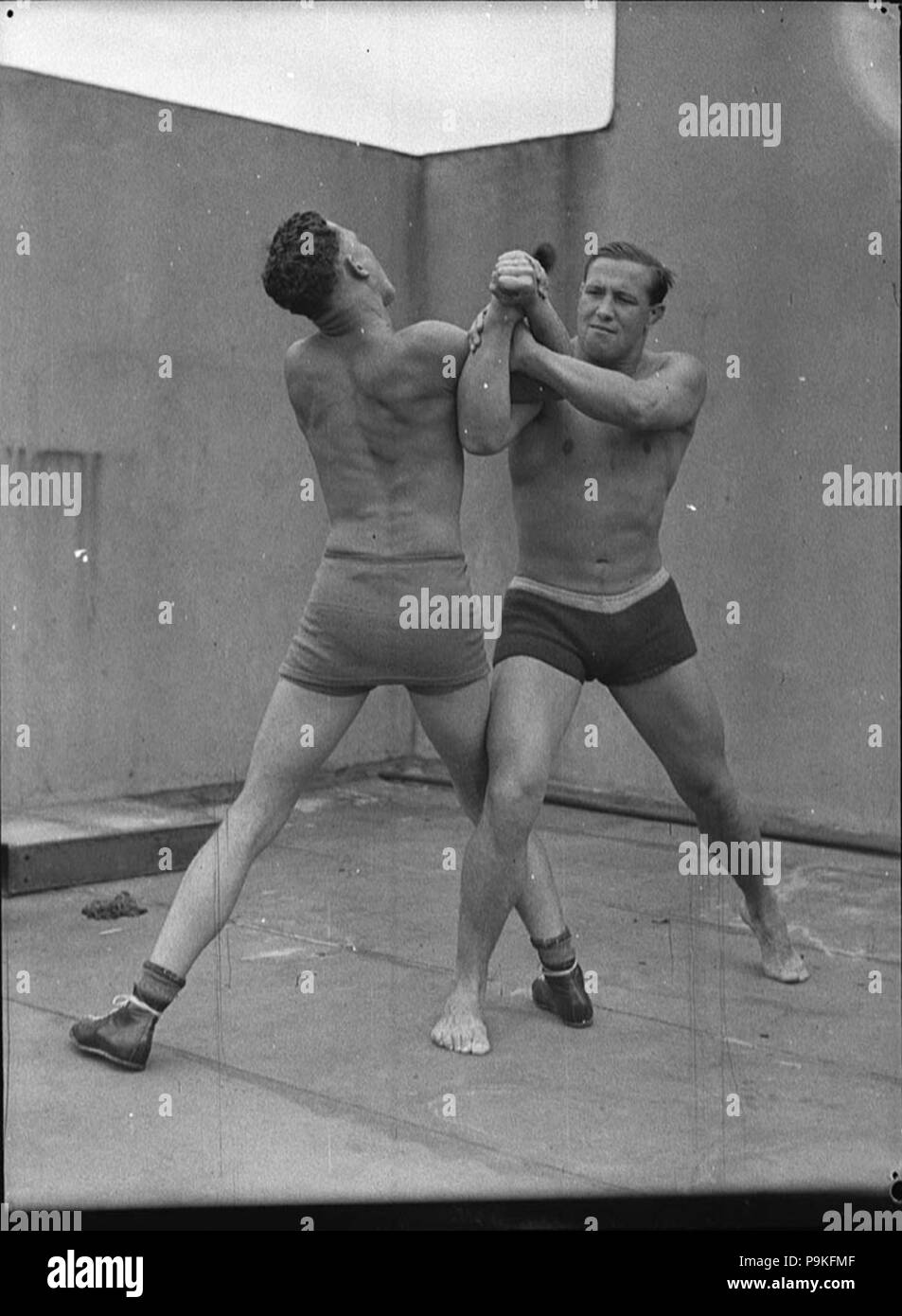 Wrestlers wrestling Black and White Stock Photos & Images - Alamy