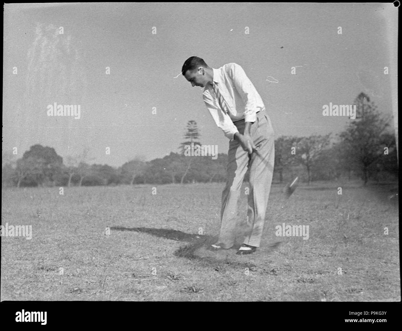 247 SLNSW 23776 Dan Cullen demonstrating golf technique for the camera ...