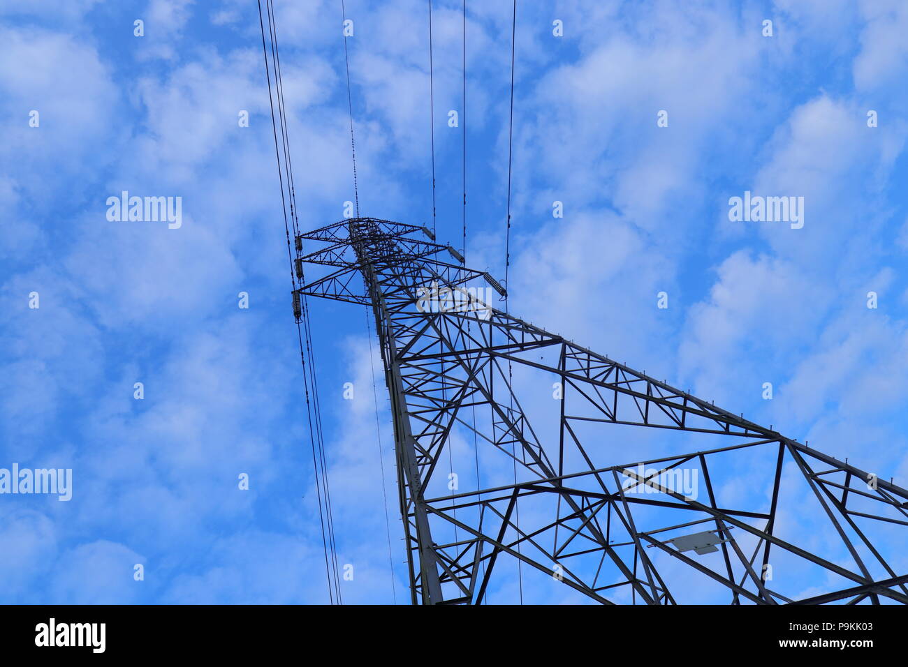 A pylon against blue skies in Swillington, Leeds Stock Photo - Alamy