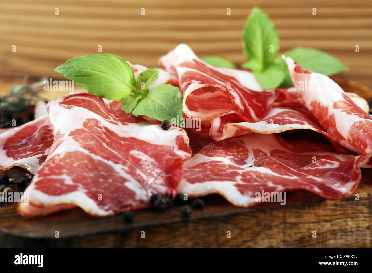 Italian sliced cured coppa with spices. Raw ham. Crudo or jamon Stock ...
