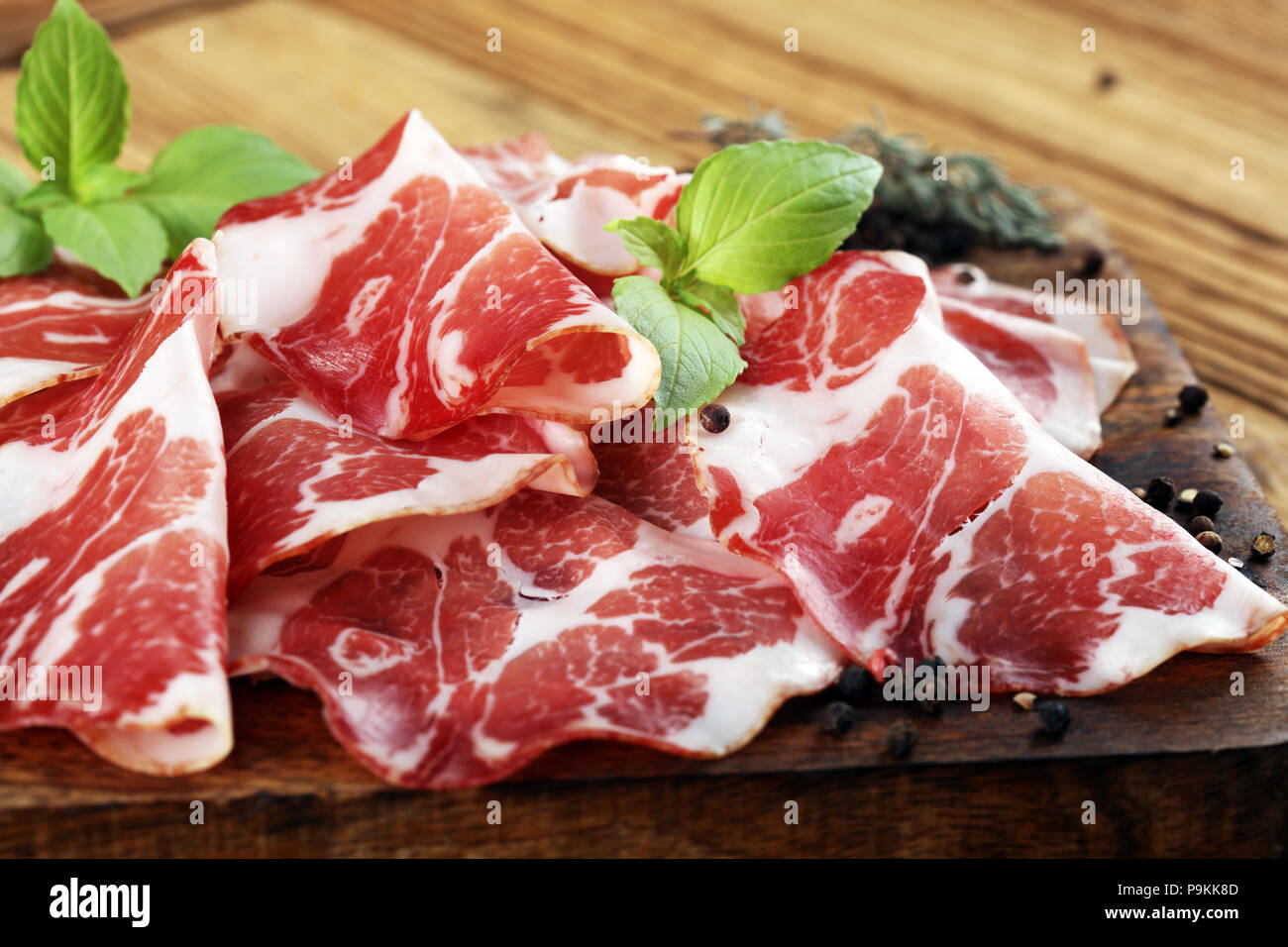 Italian sliced cured coppa with spices. Raw ham. Crudo or jamon Stock ...