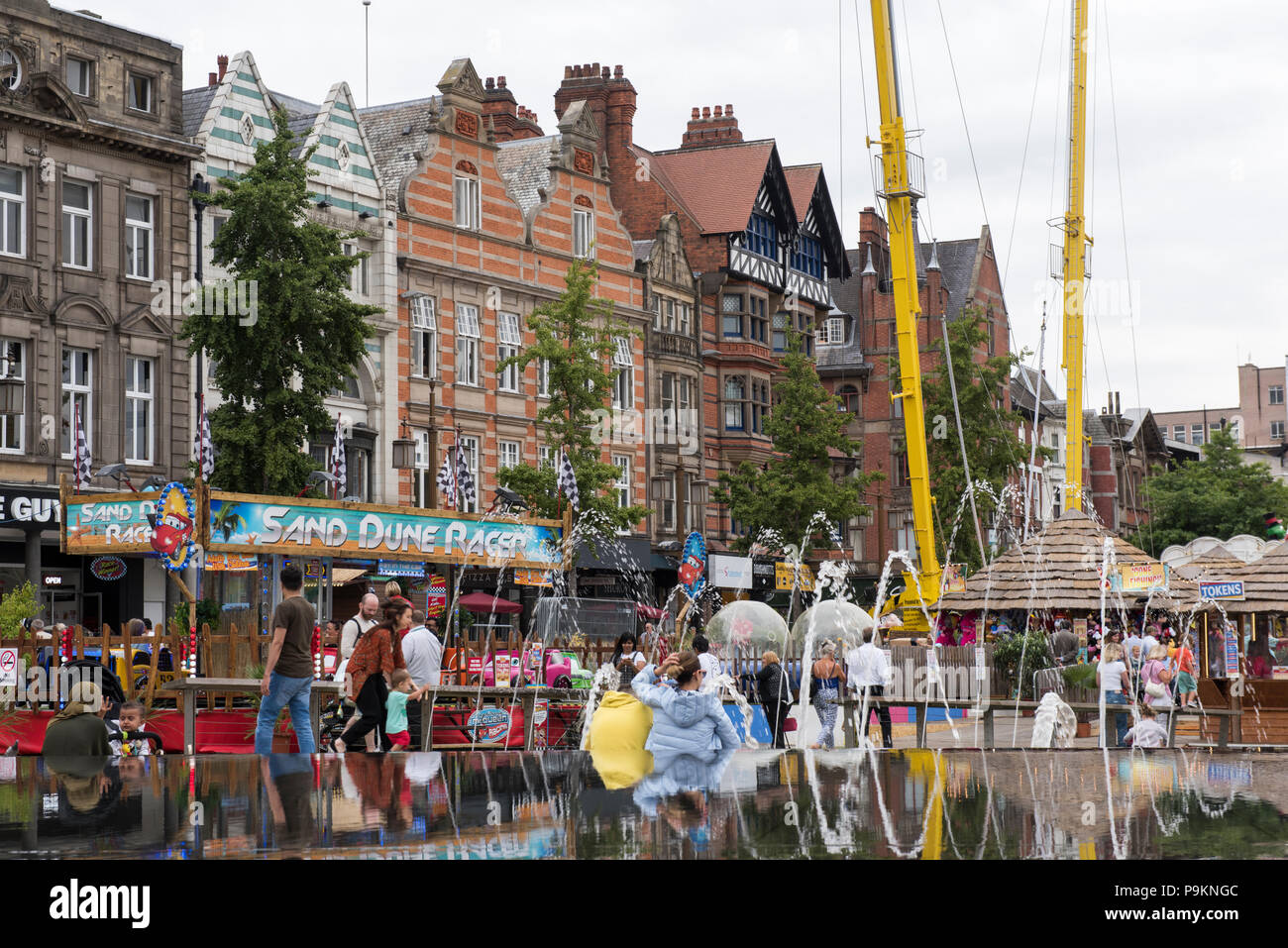 The Beach reflected in the fountains in Market Square, Nottingham City ...