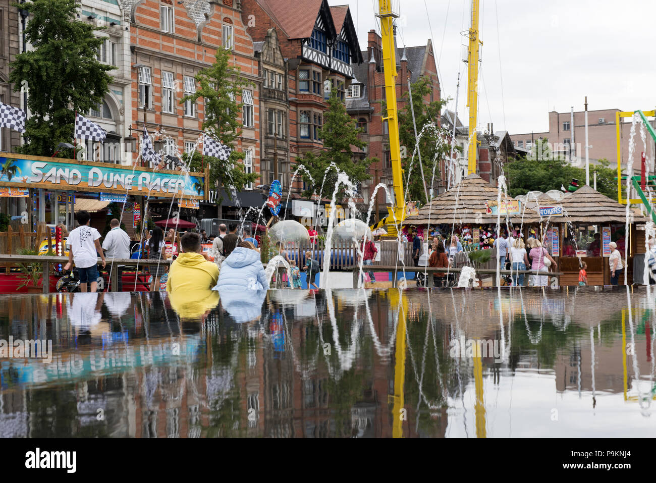 The Beach reflected in the fountains in Market Square, Nottingham City ...