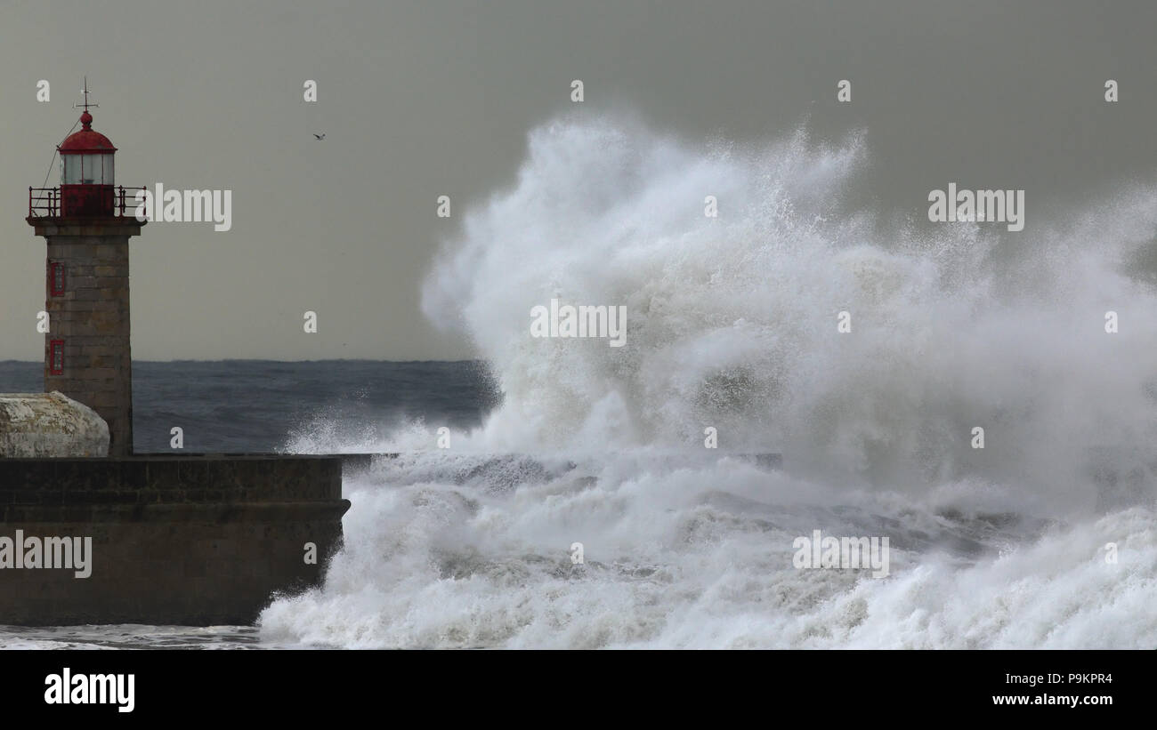 Huge wave over old lighthouse of Porto, Portugal Stock Photo - Alamy