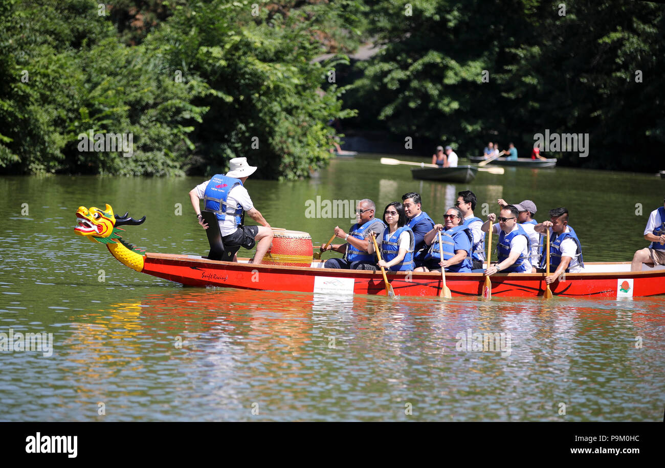 New York, USA. 18th July, 2018. Invited guests row a dragon boat prior ...