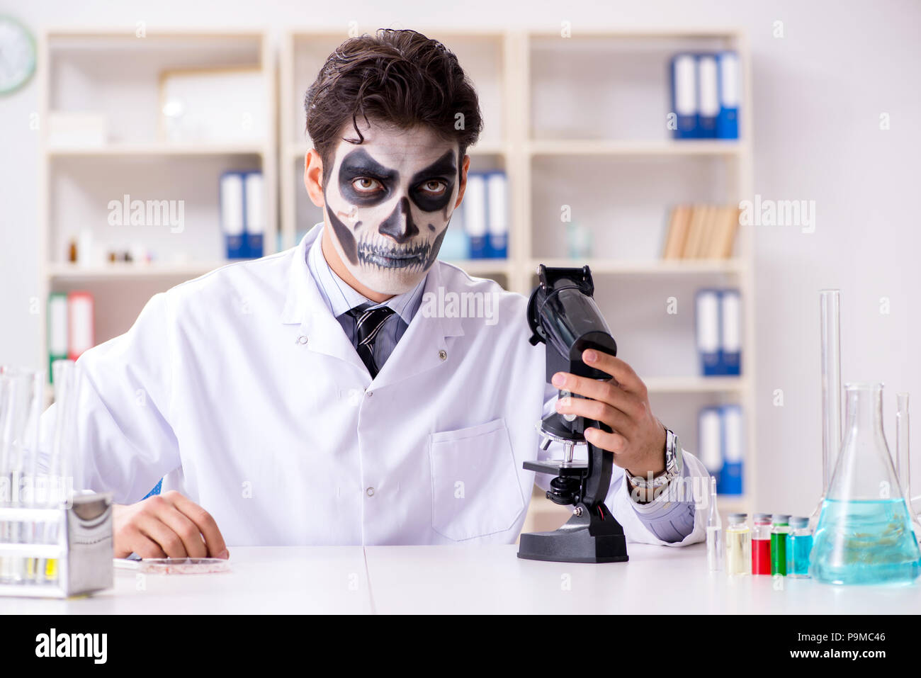 Scary monster doctor working in lab Stock Photo - Alamy