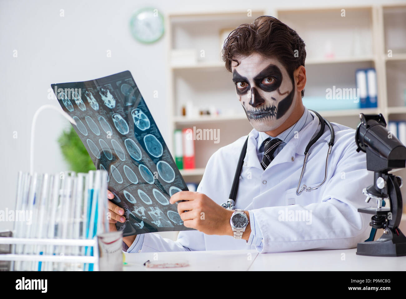 Scary monster doctor working in lab Stock Photo - Alamy