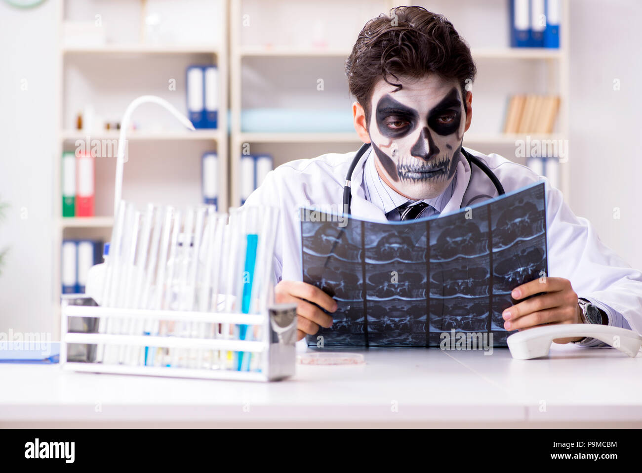 Scary monster doctor working in lab Stock Photo - Alamy
