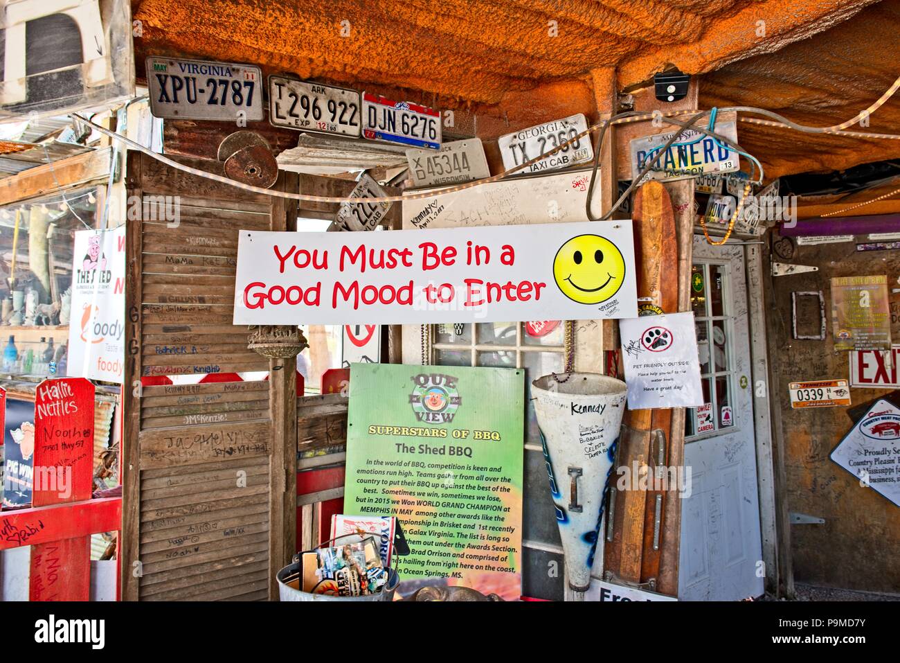 An entrance to a restaurant has a unique view of antiques and ...