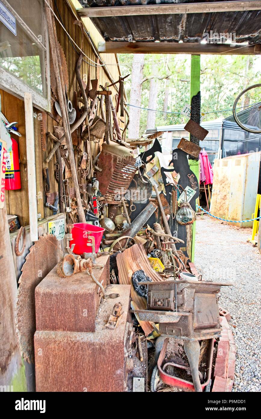 A storefront to a restaurant is loaded with rusty old antiques Stock ...