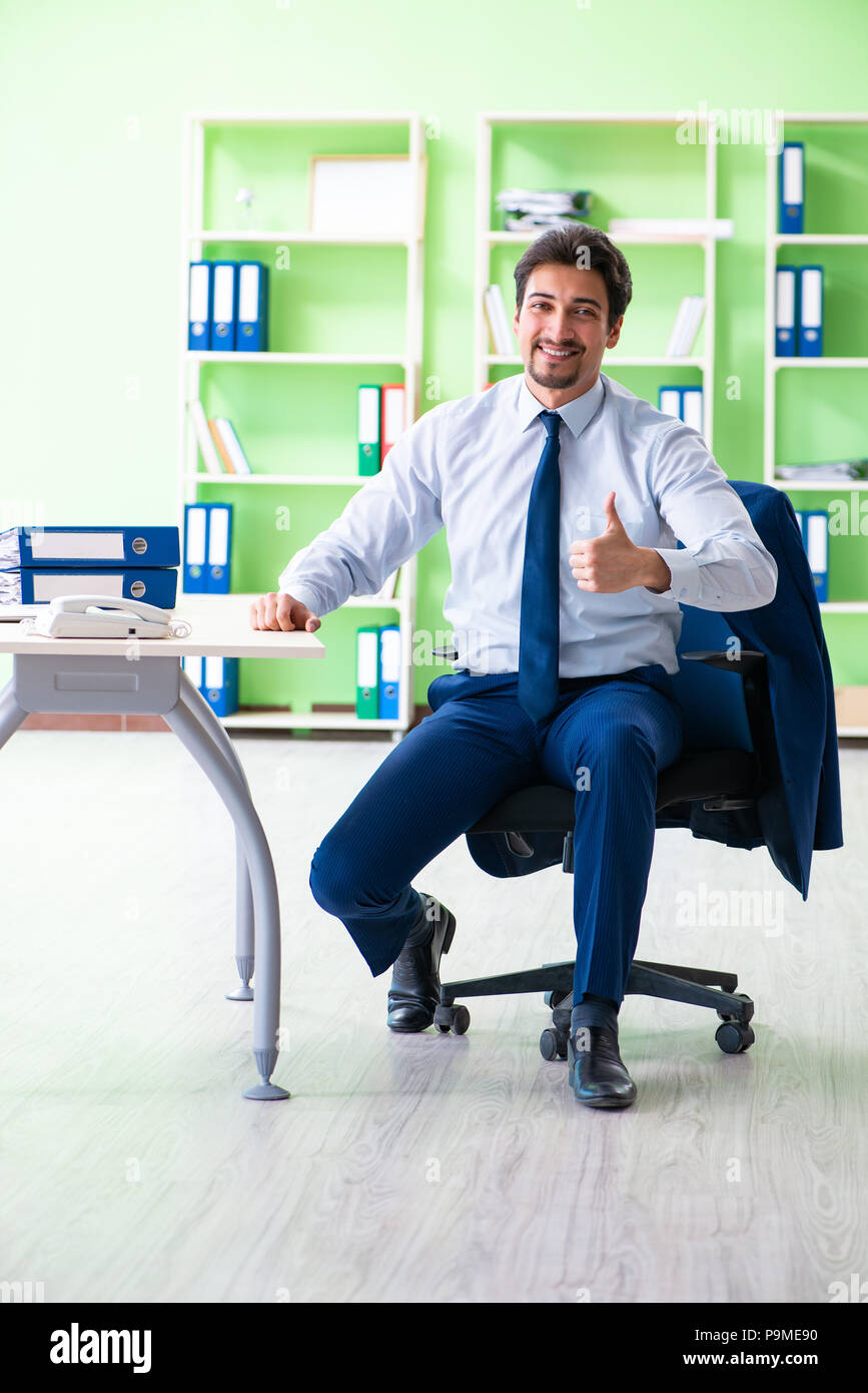 Employee doing exercises during break at work Stock Photo - Alamy