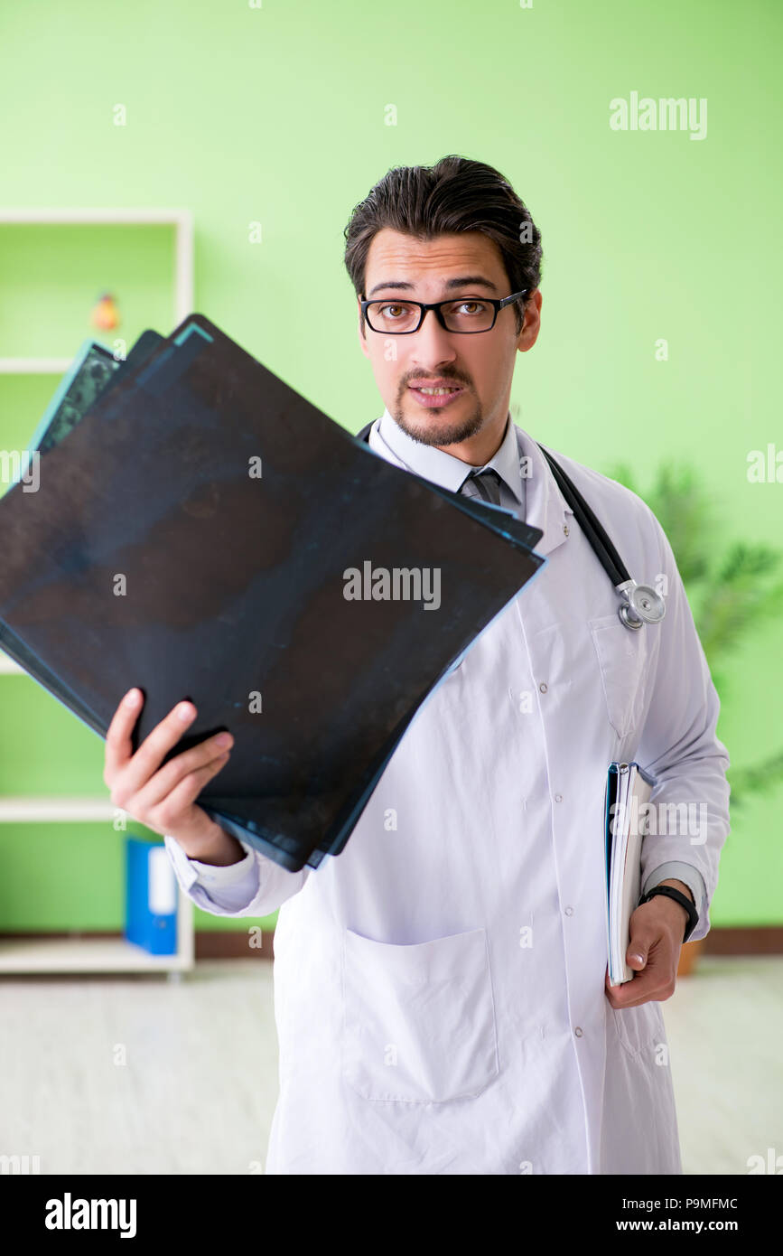 Doctor radiologist looking at x-ray scan in hospital Stock Photo - Alamy
