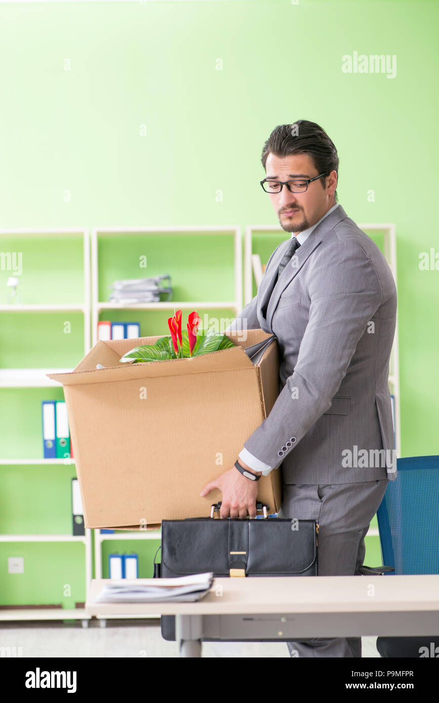 Male employee collecting his stuff after redundancy Stock Photo - Alamy